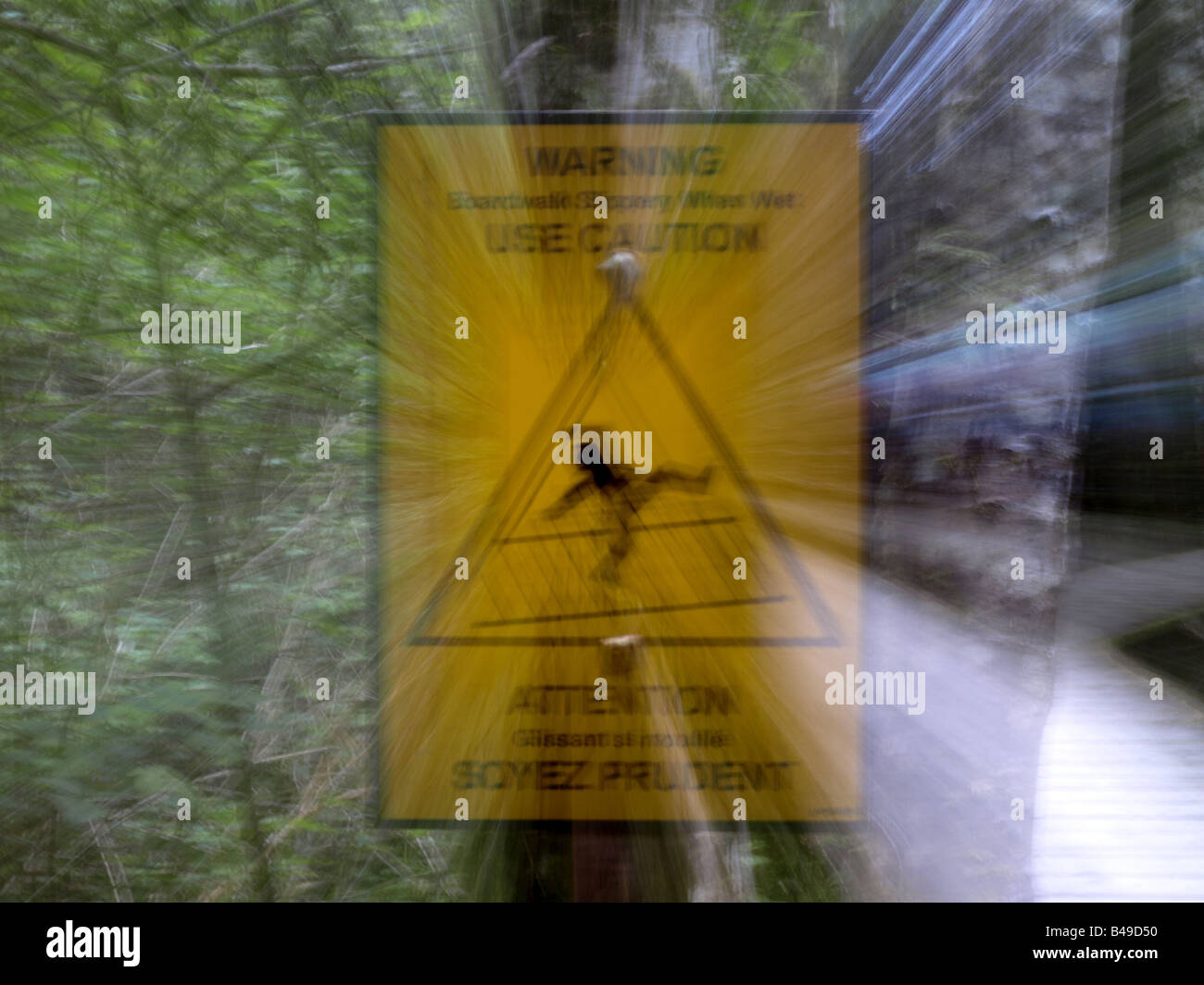Warning sign with blur Stock Photo - Alamy