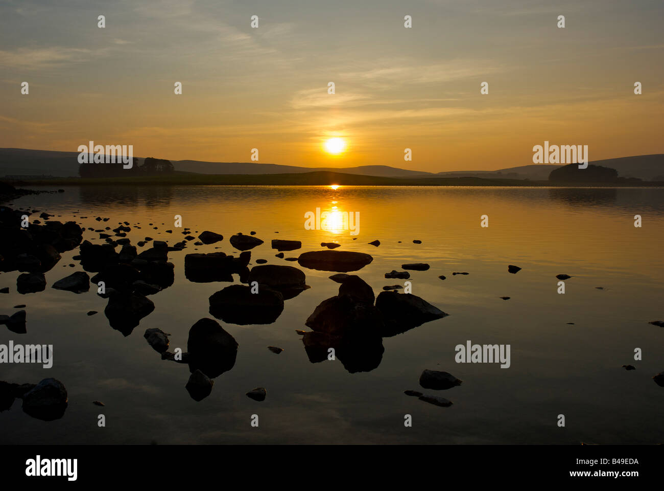 Sun setting over Malham Tarn, Yorkshire Dales National Park, North ...