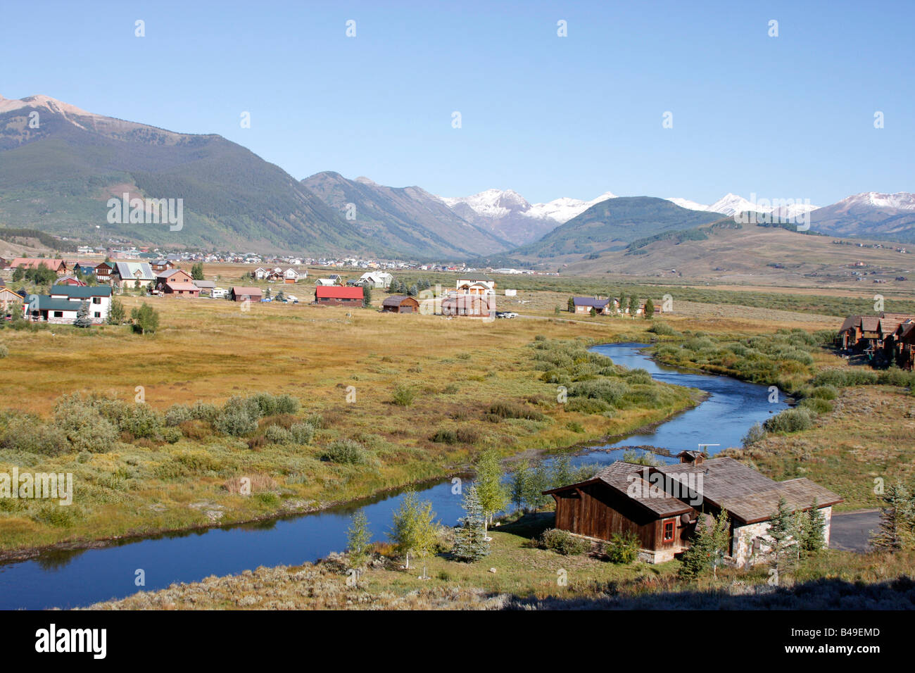 Slate River winds through the homes of Crested Butte,Colorado,USA.MR ...