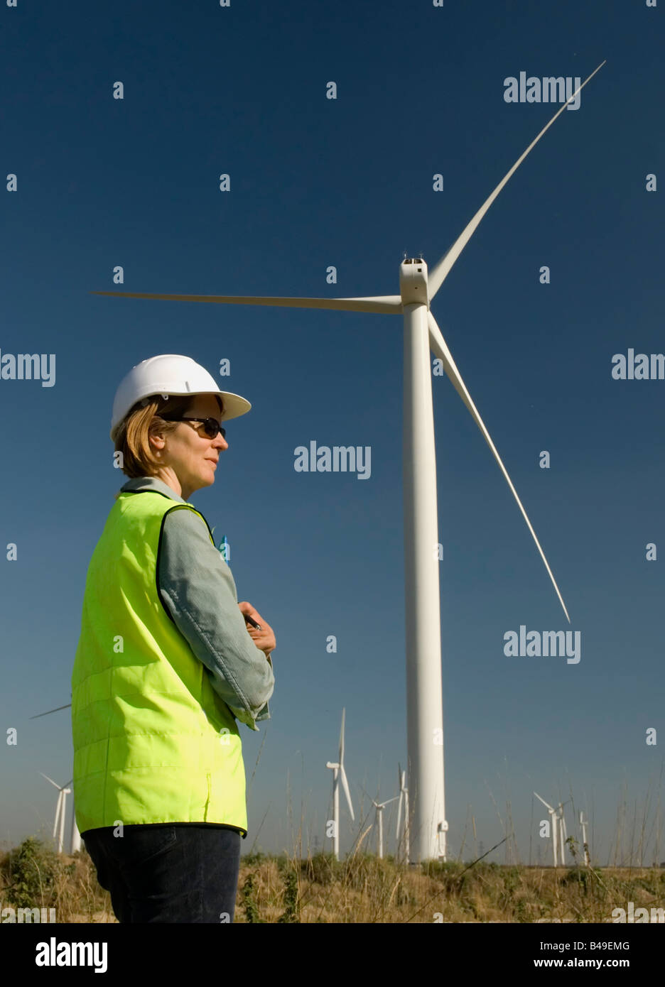 Female engineer at wind turbine wind farm Stock Photo - Alamy