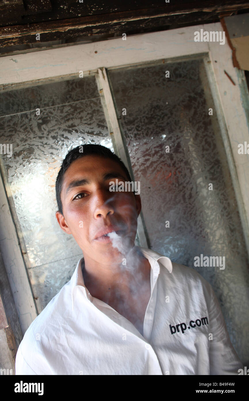 Roma gypsy boy smoking at his home in Share, a slum next to a rubbish ...