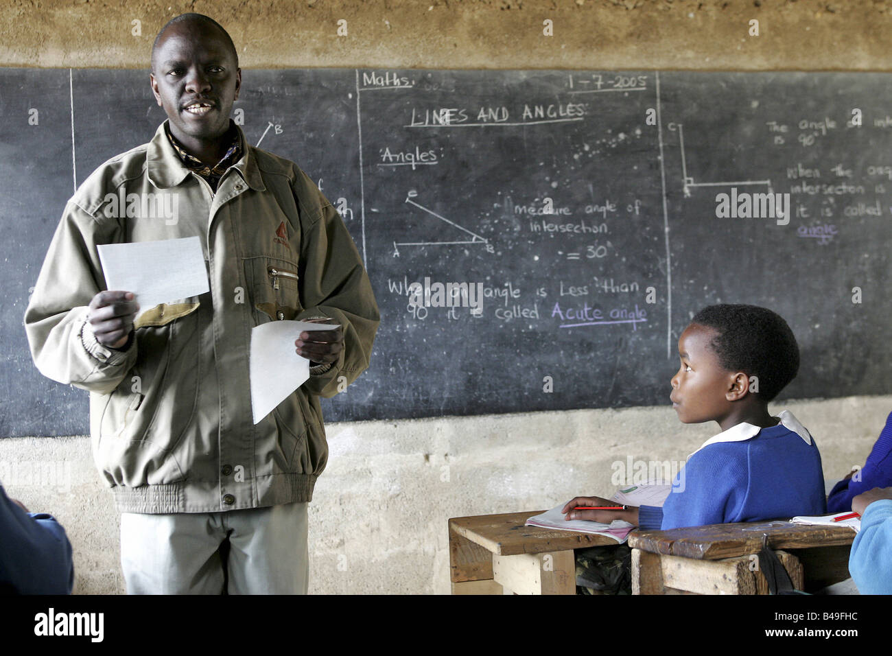 Poor african classroom and teacher hi-res stock photography and images ...