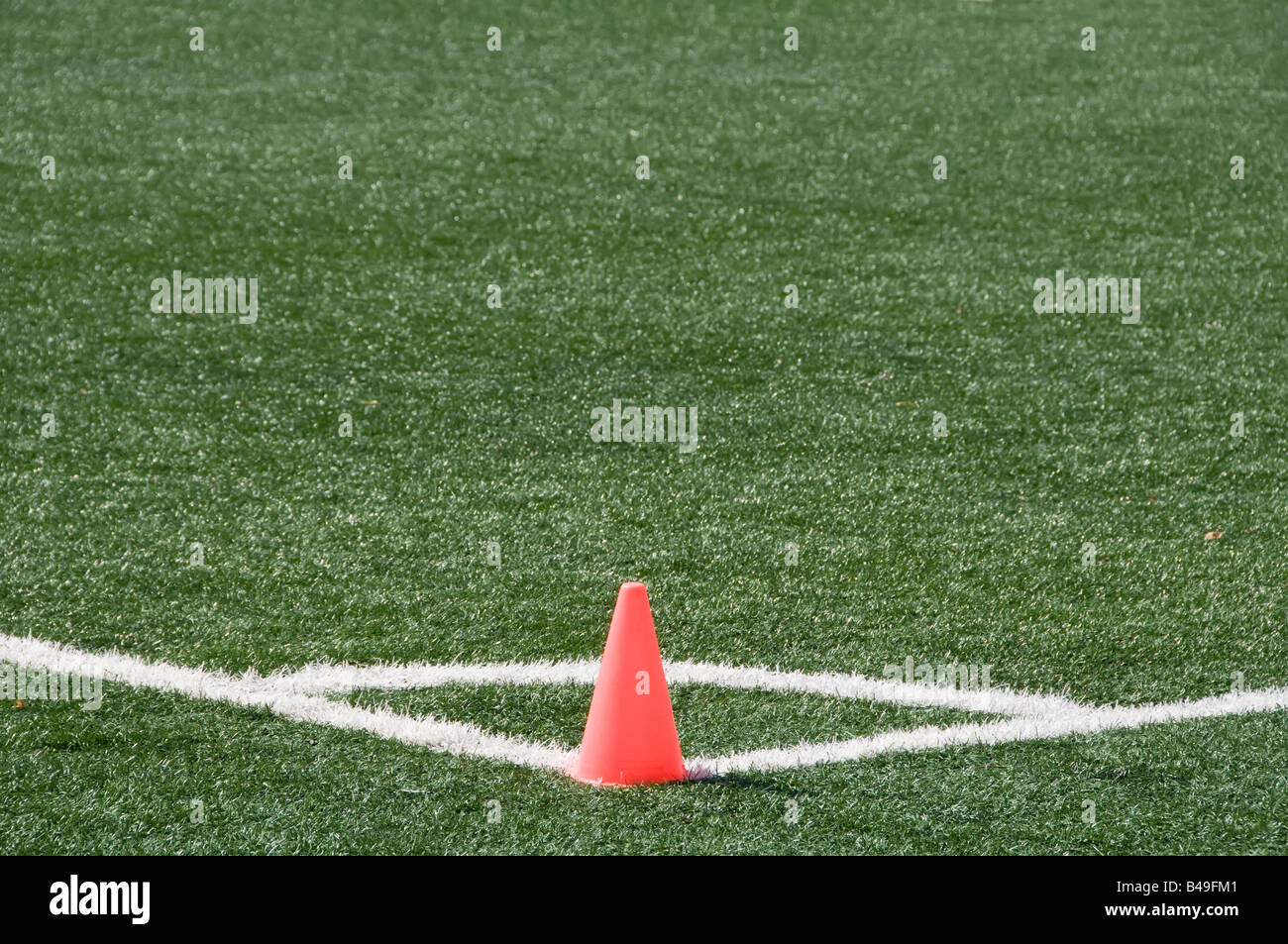 Pink cone standing at corner of football soccer field Stock Photo - Alamy