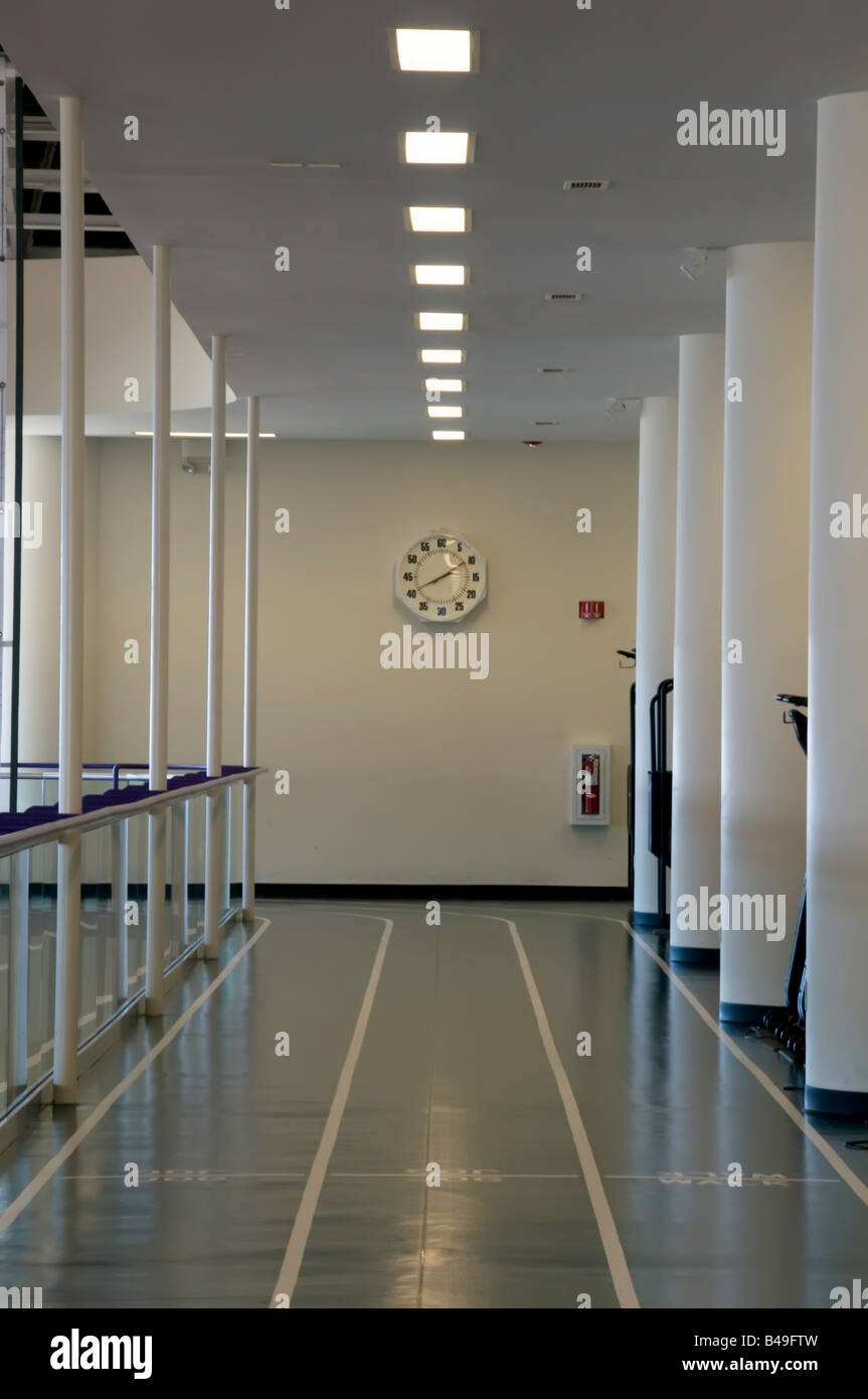 Indoor running track with analog clock on wall Stock Photo - Alamy