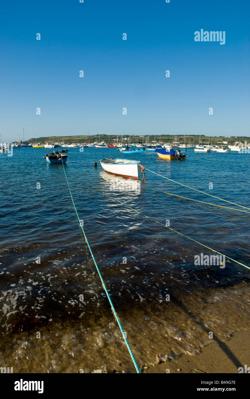 Tethered rowing boats on a perfect evening in Town Bay, Hugh Town, St ...