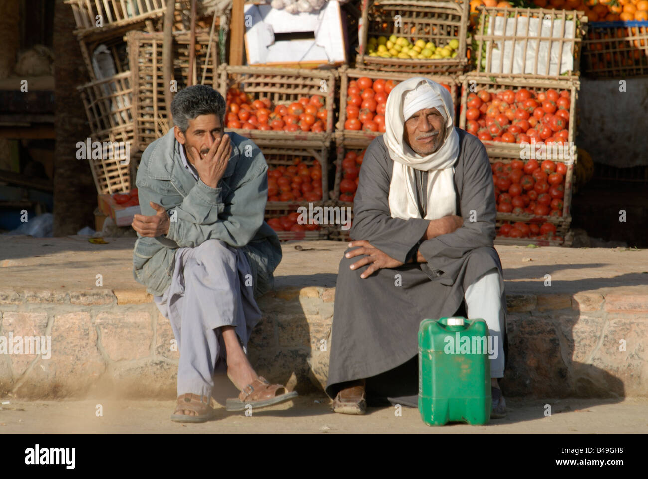 Two men having a chat Oasis Siwa Egypt Stock Photo - Alamy