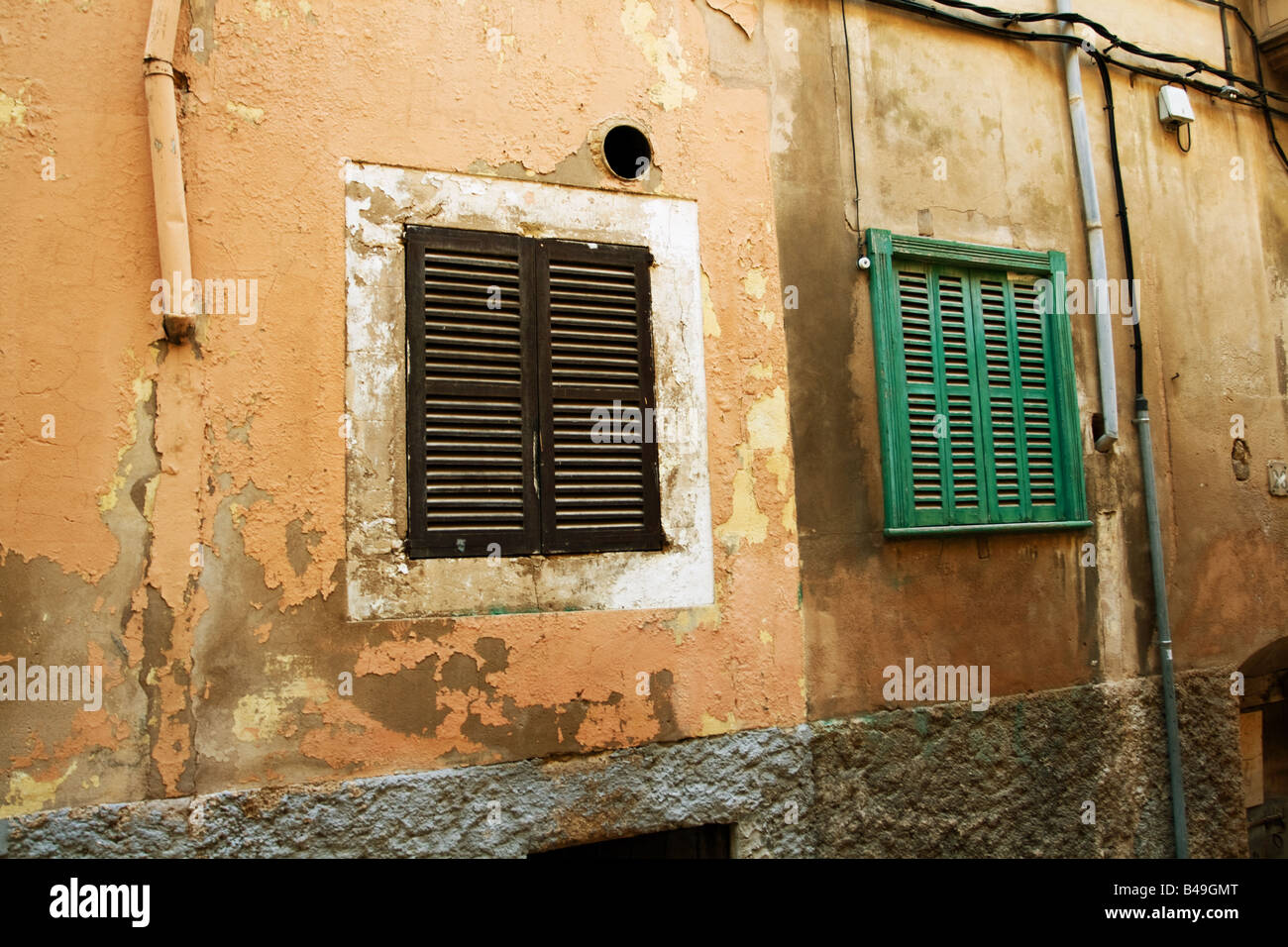 Wooden shutters and wall with peeling paint in the Gothic Quarter of ...