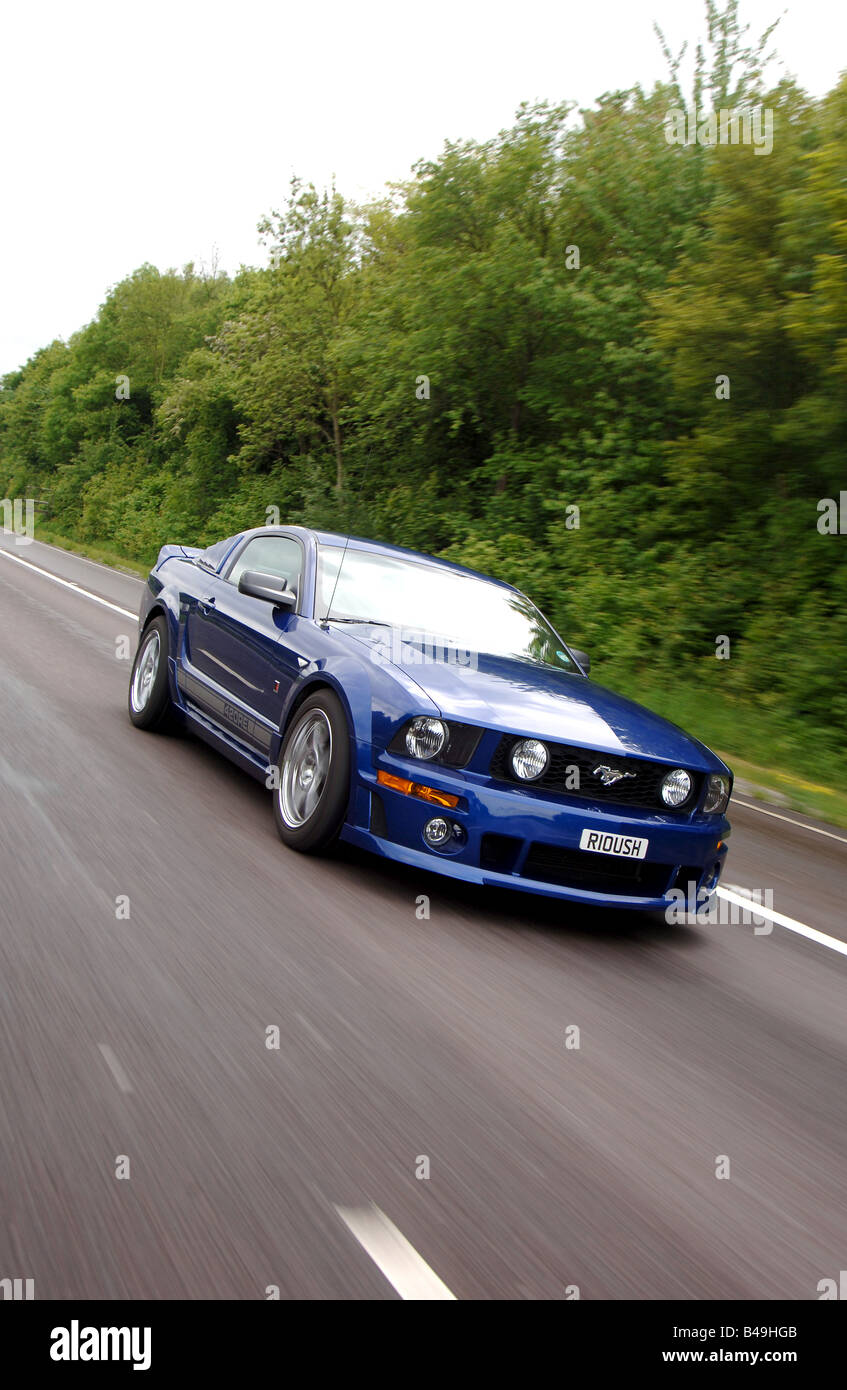 Roush Ford Mustang driving tracking car to car action Stock Photo - Alamy