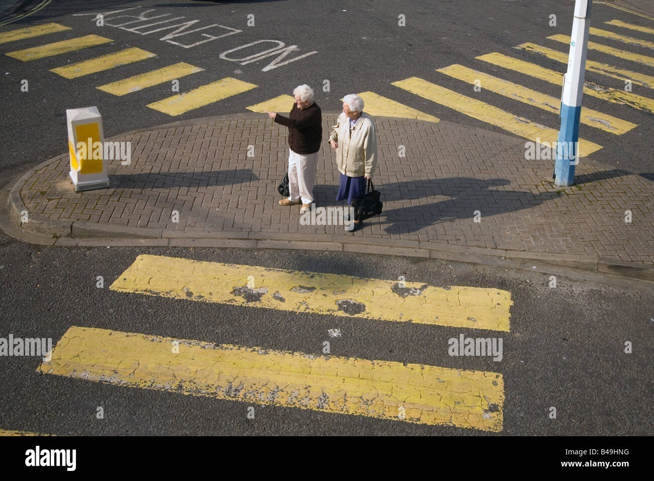 two senior citizens crossing the road in portsmouth england Stock Photo ...