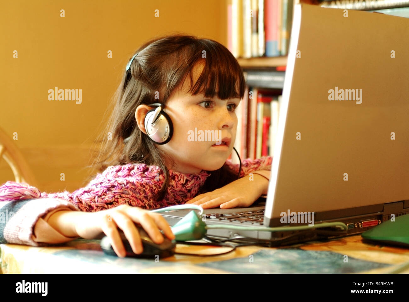 Child using laptop wearing headset hi-res stock photography and images ...