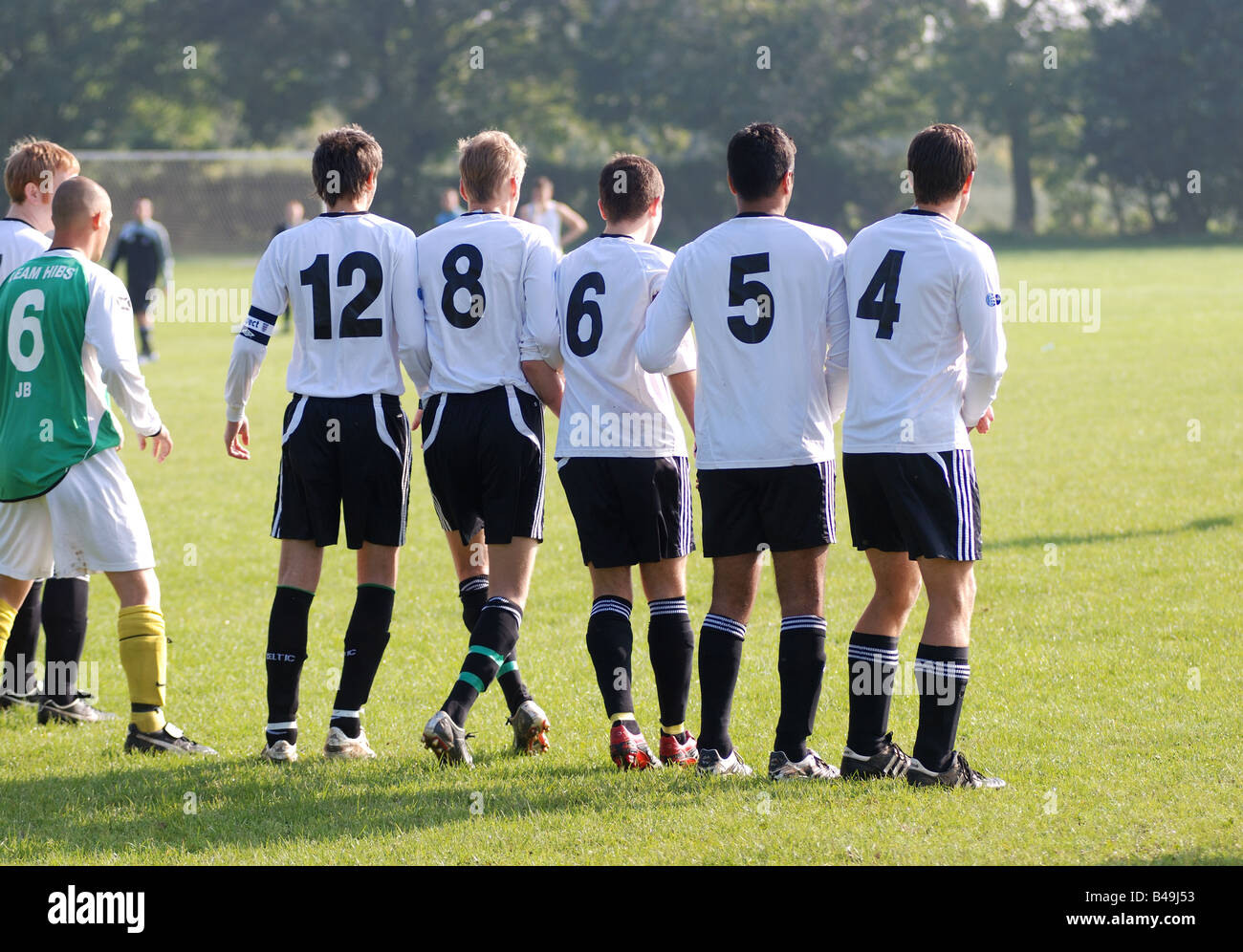 Players wall for free kick in Sunday League football match Leamington ...