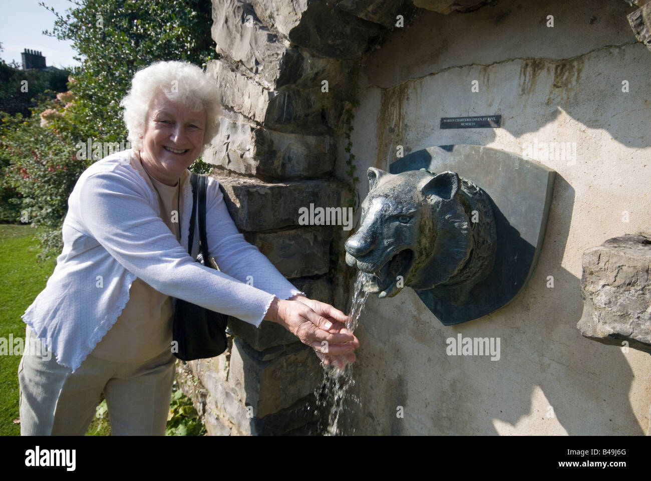 Women at Water Fountain Stock Photo - Alamy