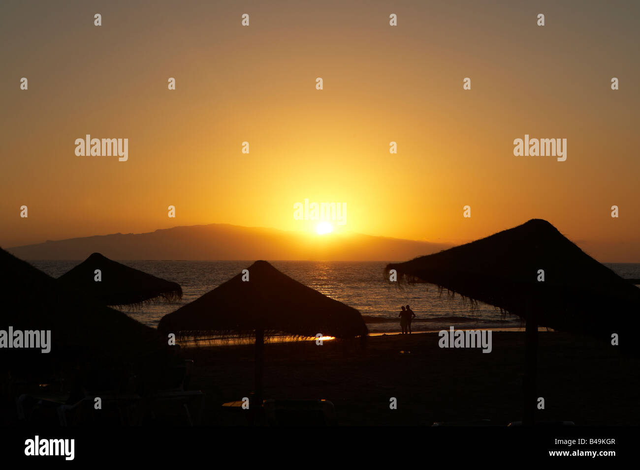 Sunset over tenerife beach Stock Photo - Alamy