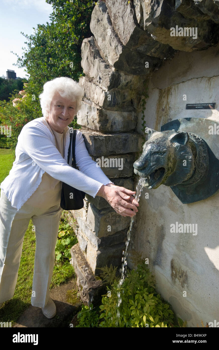 Women at Water Fountain Stock Photo - Alamy