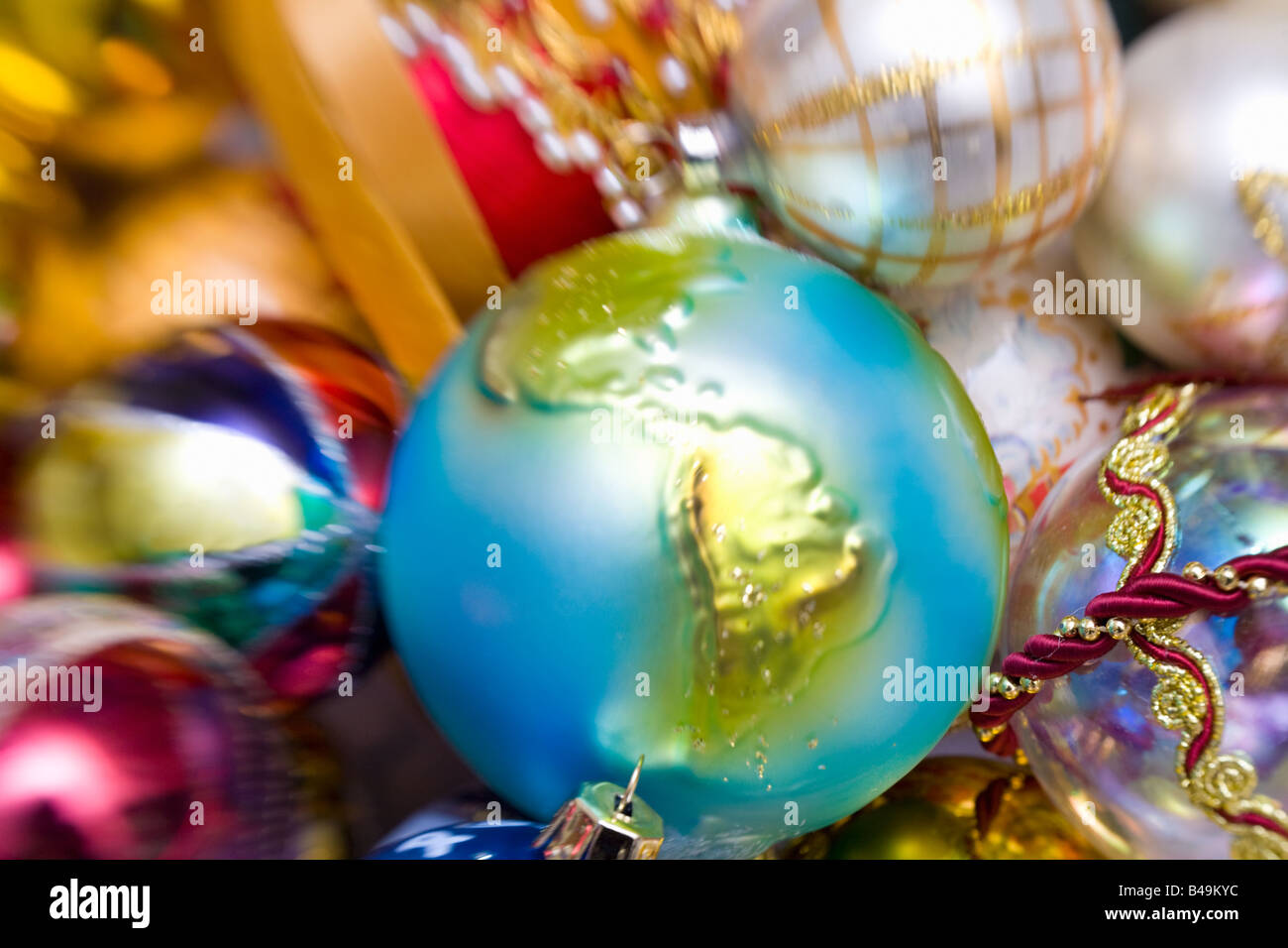 A collection of Christmas baubles, one in the shape of a globe Stock ...