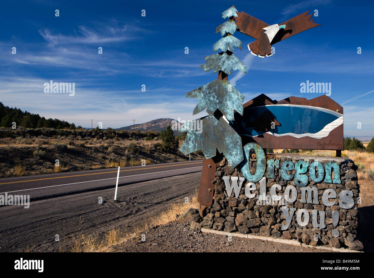 Oregon sculpture welcome sign with a bald eagle soaring over an ...