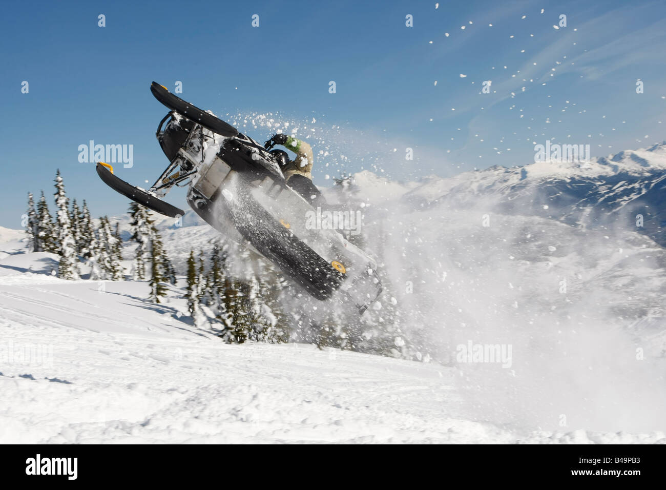 jumping a snowmobile catching big air Stock Photo - Alamy