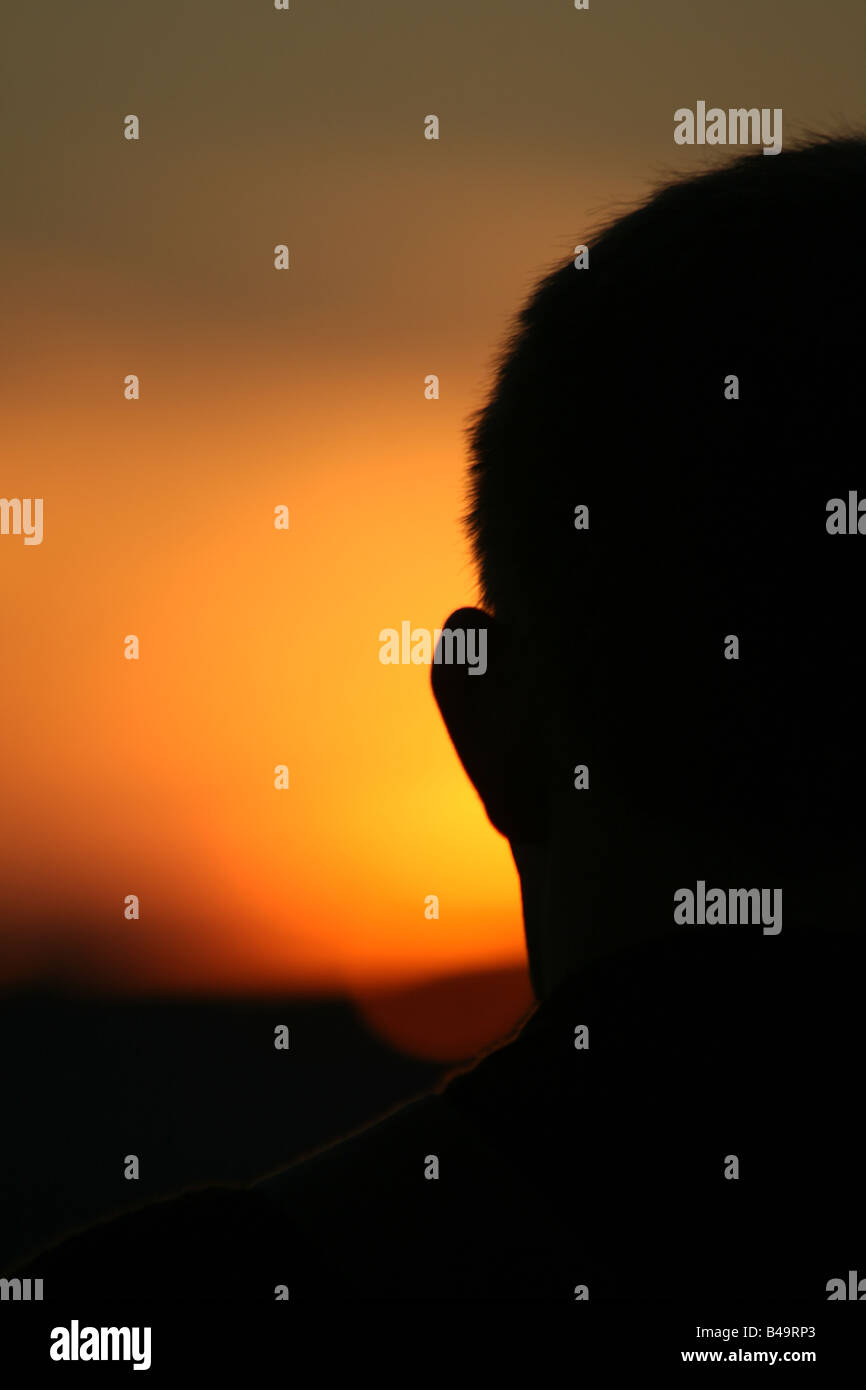 one single man silhouette at sunset Stock Photo - Alamy