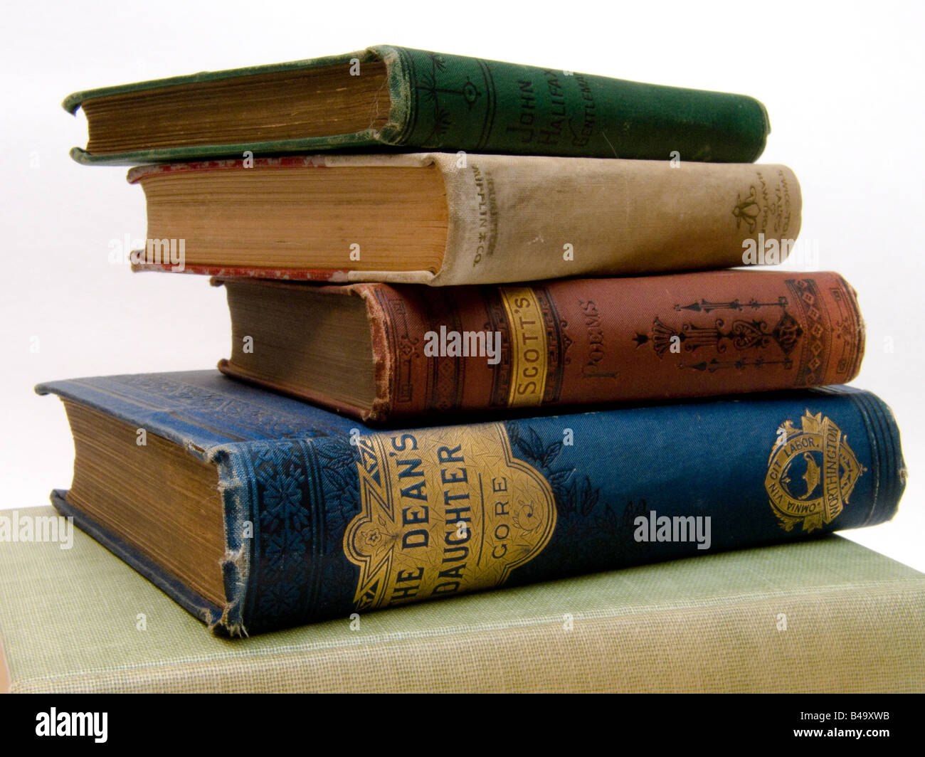 A stack of interesting looking antique books on a white background ...