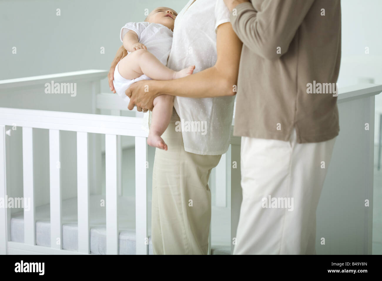 Standing mother carries hi-res stock photography and images - Alamy