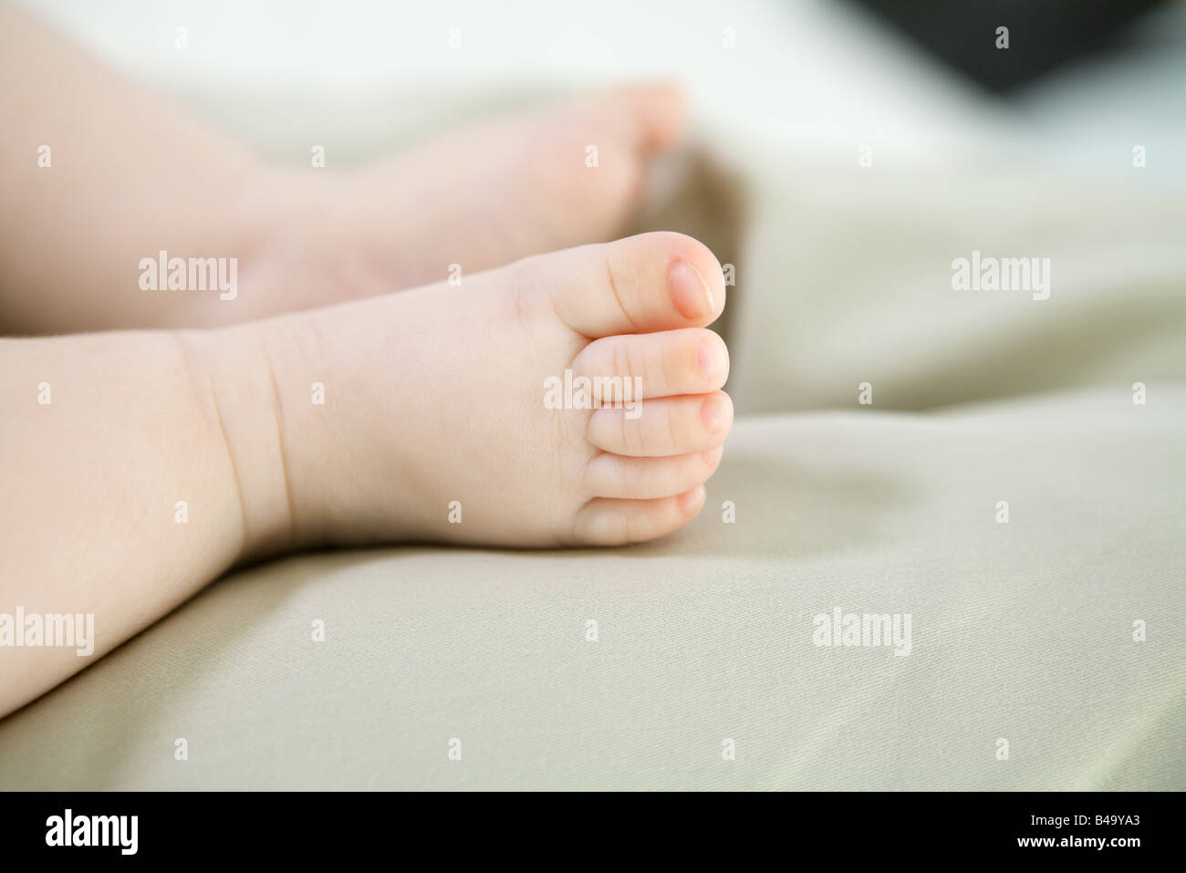 Infant's bare feet, close-up Stock Photo - Alamy