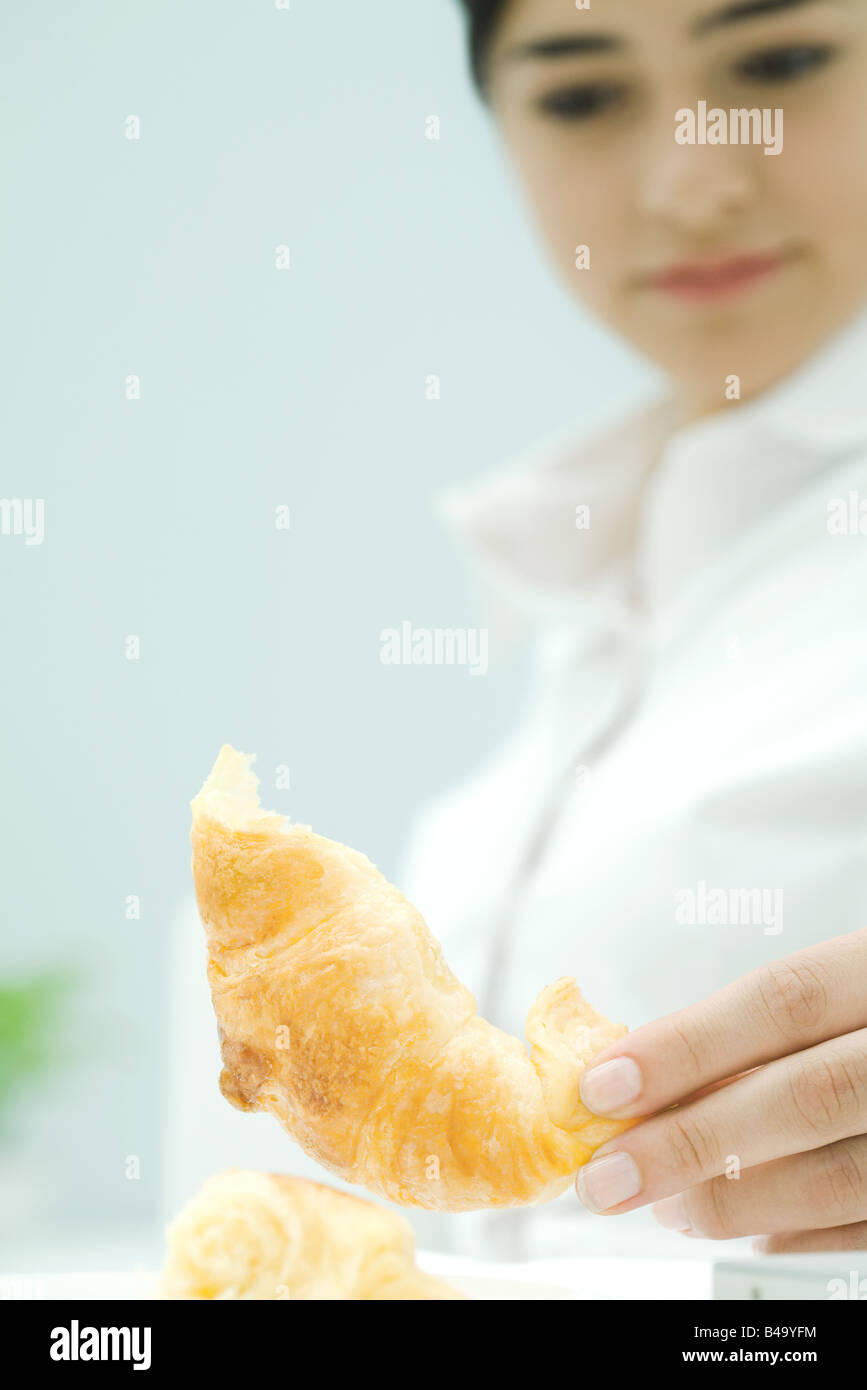 Young women eating croissants hi-res stock photography and images - Alamy