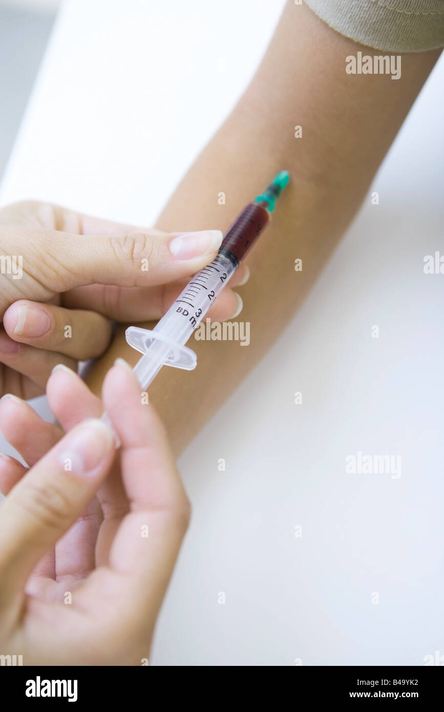 Doctor taking patient's blood with syringe, cropped view Stock Photo ...