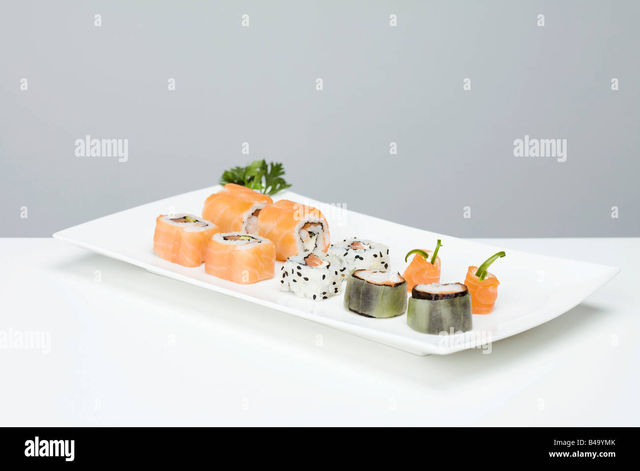 Assorted maki sushi arranged on sushi plate Stock Photo - Alamy