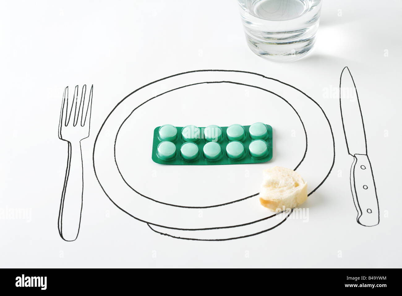 Blister pack of pills and small piece of bread on drawing of plate ...