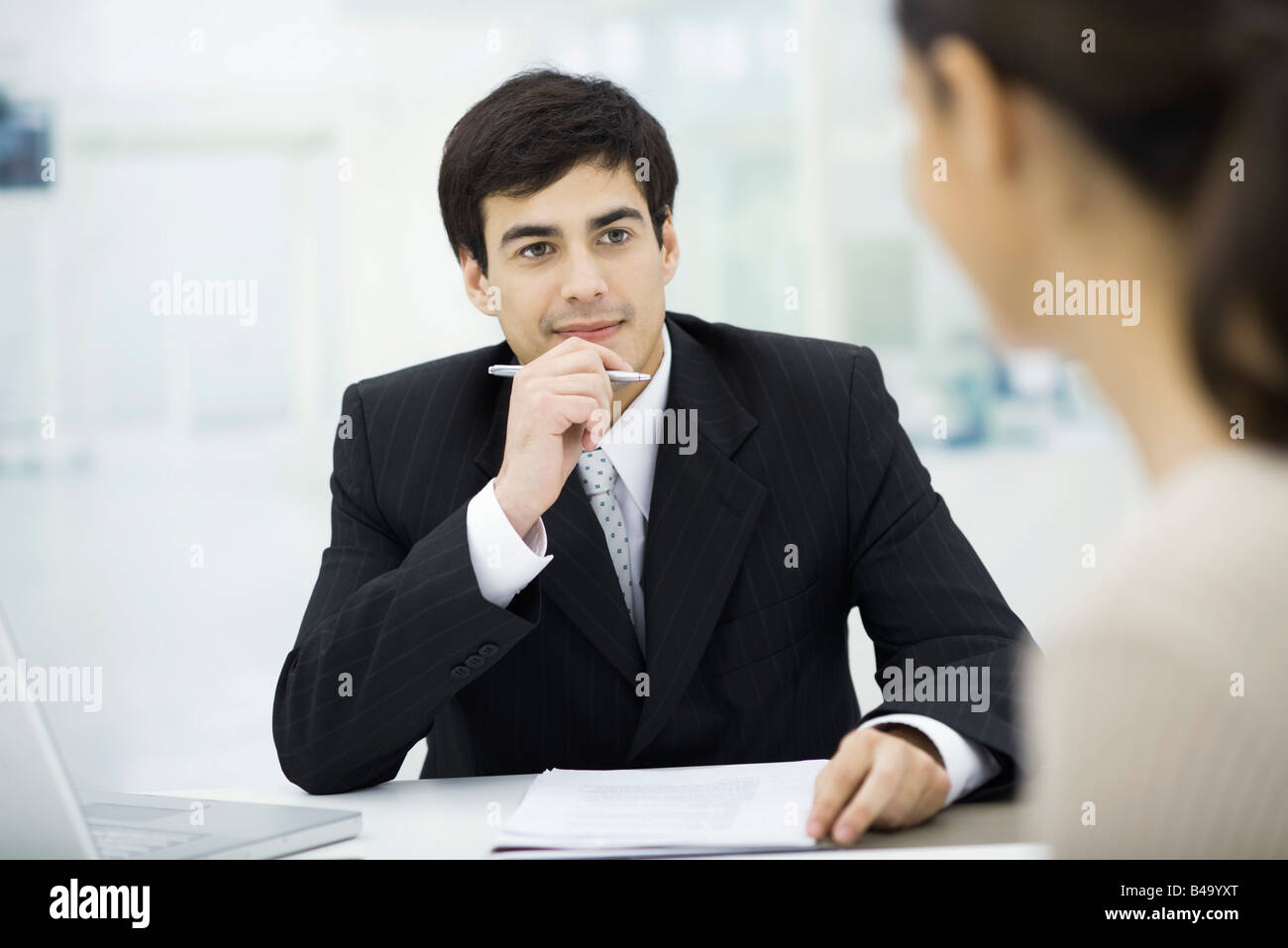 Businessman listening carefully to client Stock Photo - Alamy