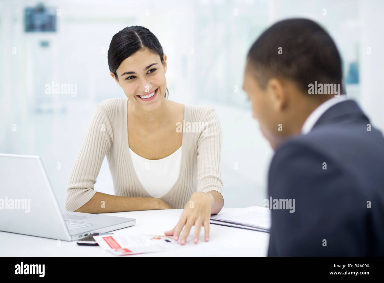 Meeting between professional and client, discussing document Stock ...