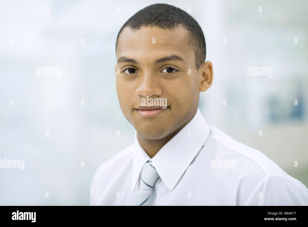 Professional man smiling at camera, portrait Stock Photo - Alamy