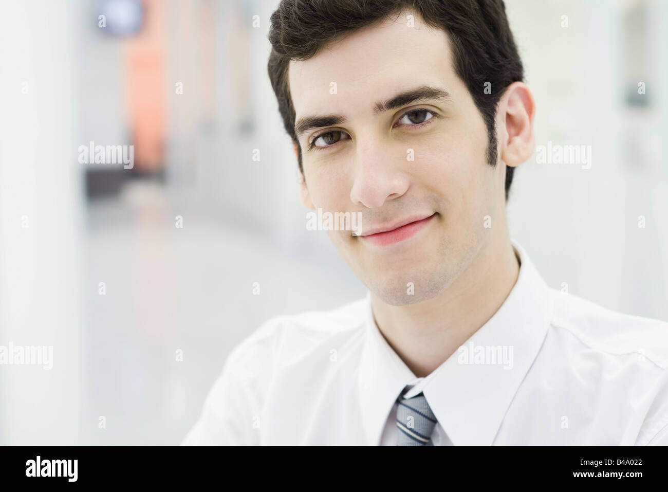 Professional man smiling at camera, portrait Stock Photo - Alamy