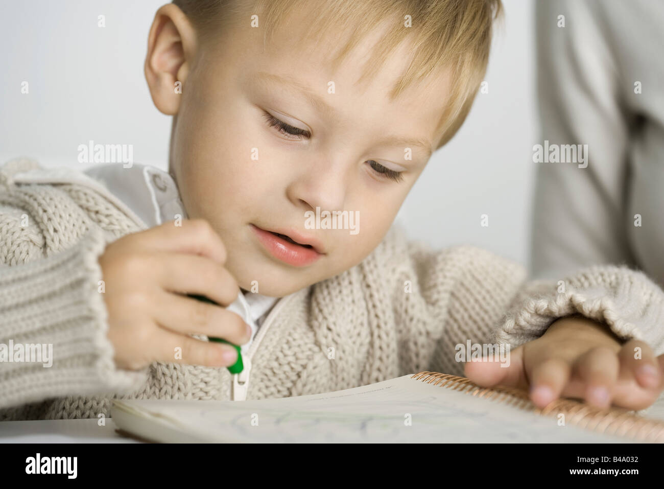 Little boy coloring with crayon, close-up Stock Photo - Alamy
