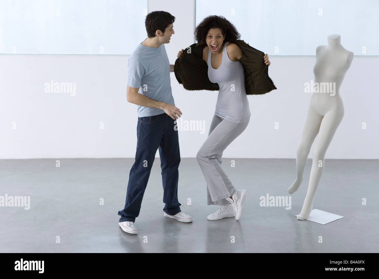 Woman pulling open jacket hi-res stock photography and images - Alamy