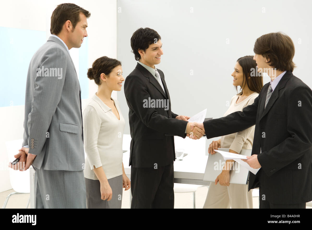 Mature business man consulting his watch hi-res stock photography and ...