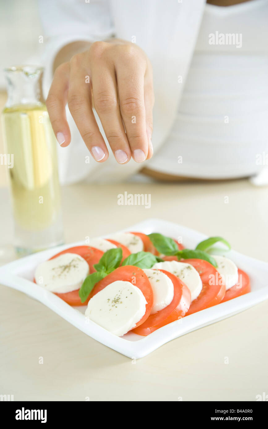 Sprinkling seasoning chefs hands hi-res stock photography and images ...