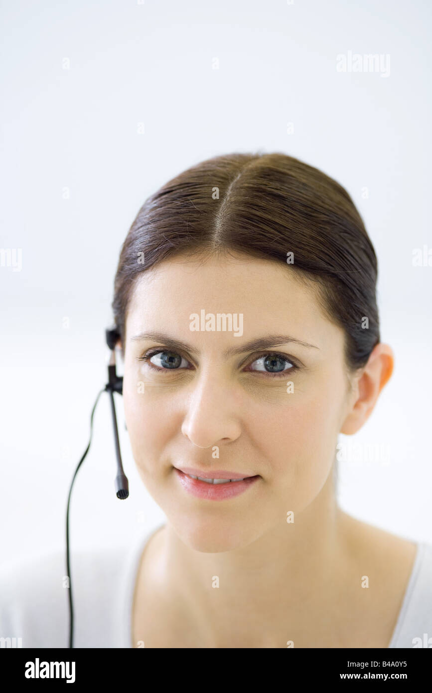 Woman wearing headset, portrait Stock Photo - Alamy