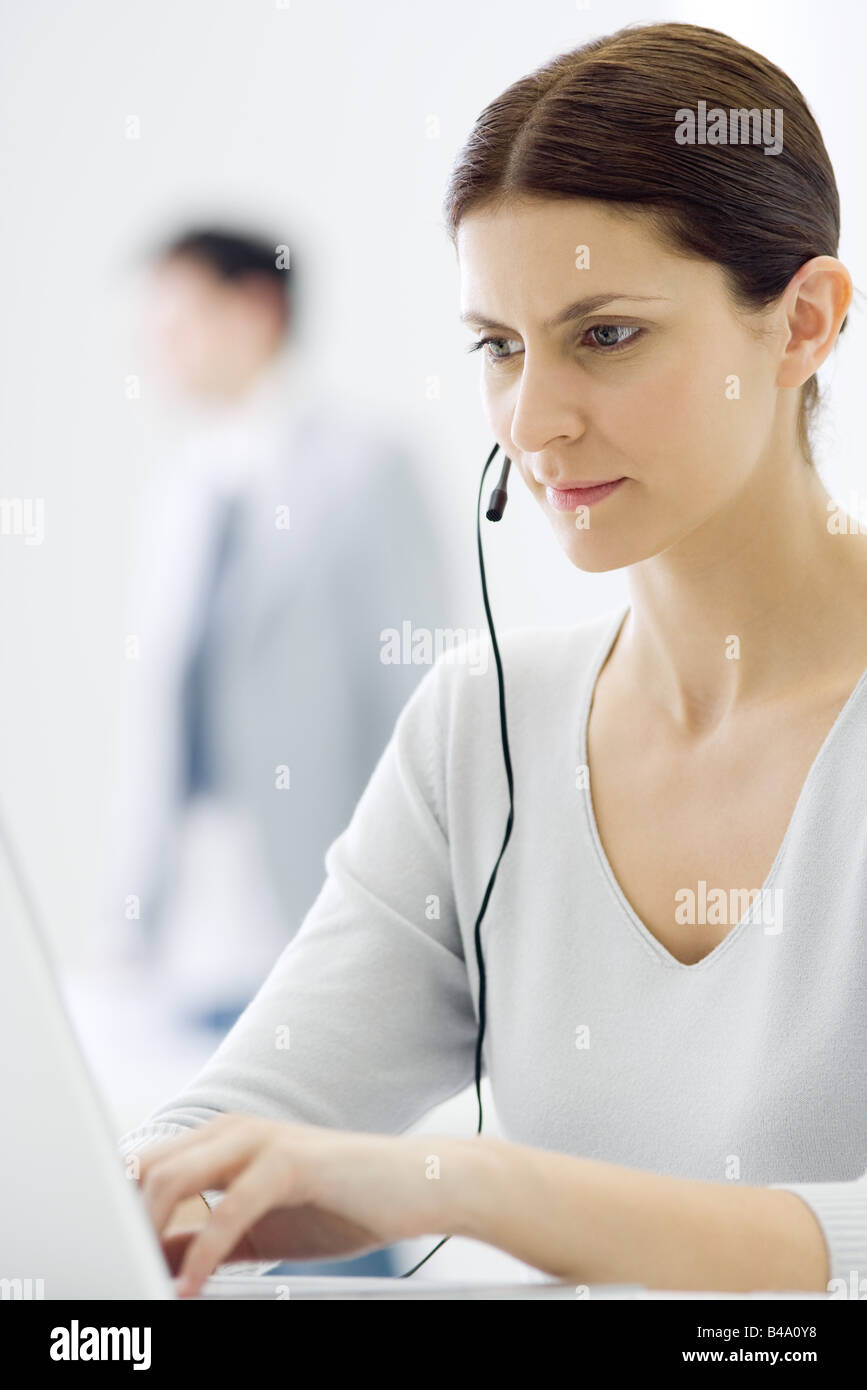 Two business people wearing headsets hi-res stock photography and ...