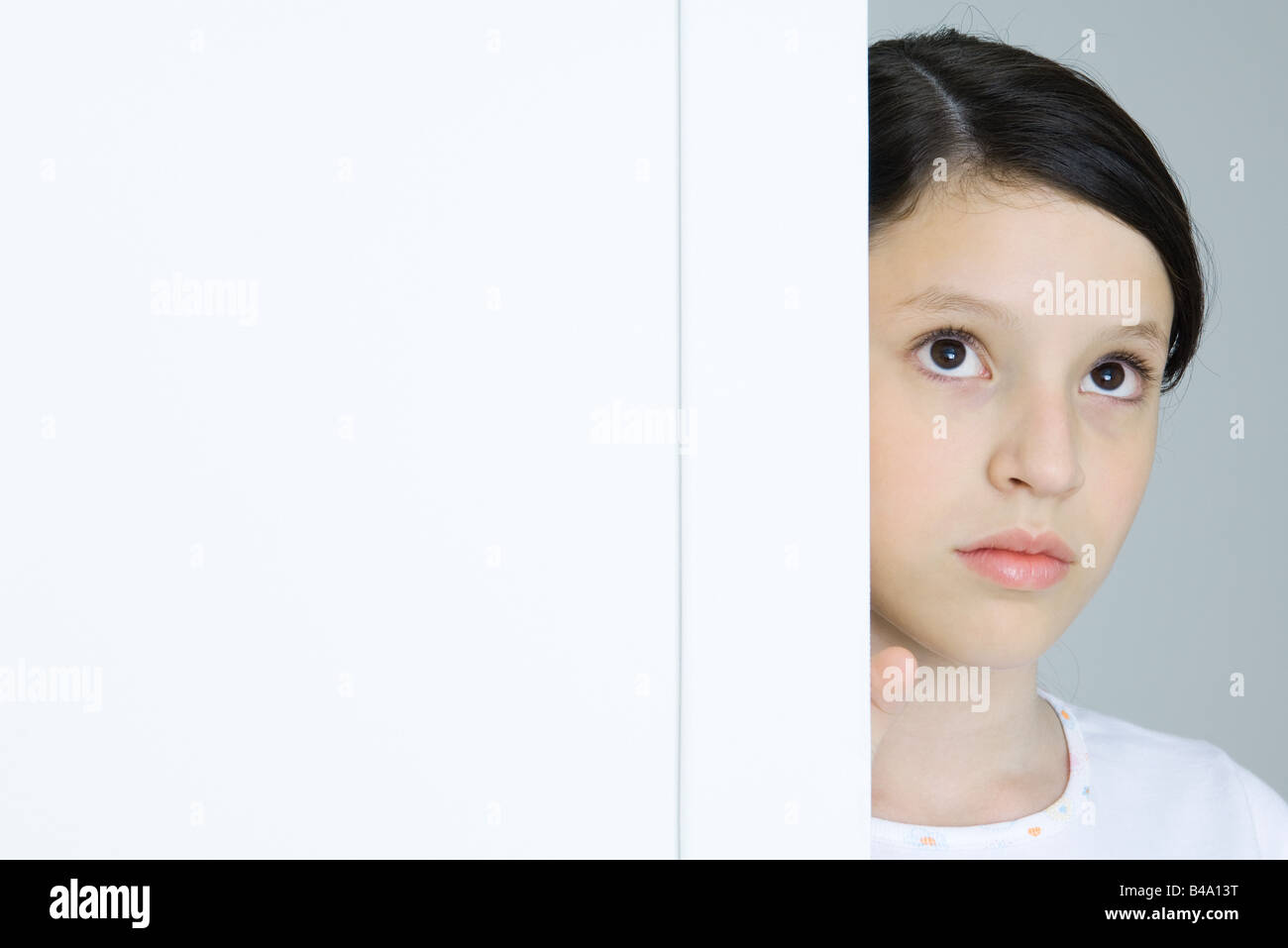 Girl in doorway, looking up, close-up Stock Photo - Alamy