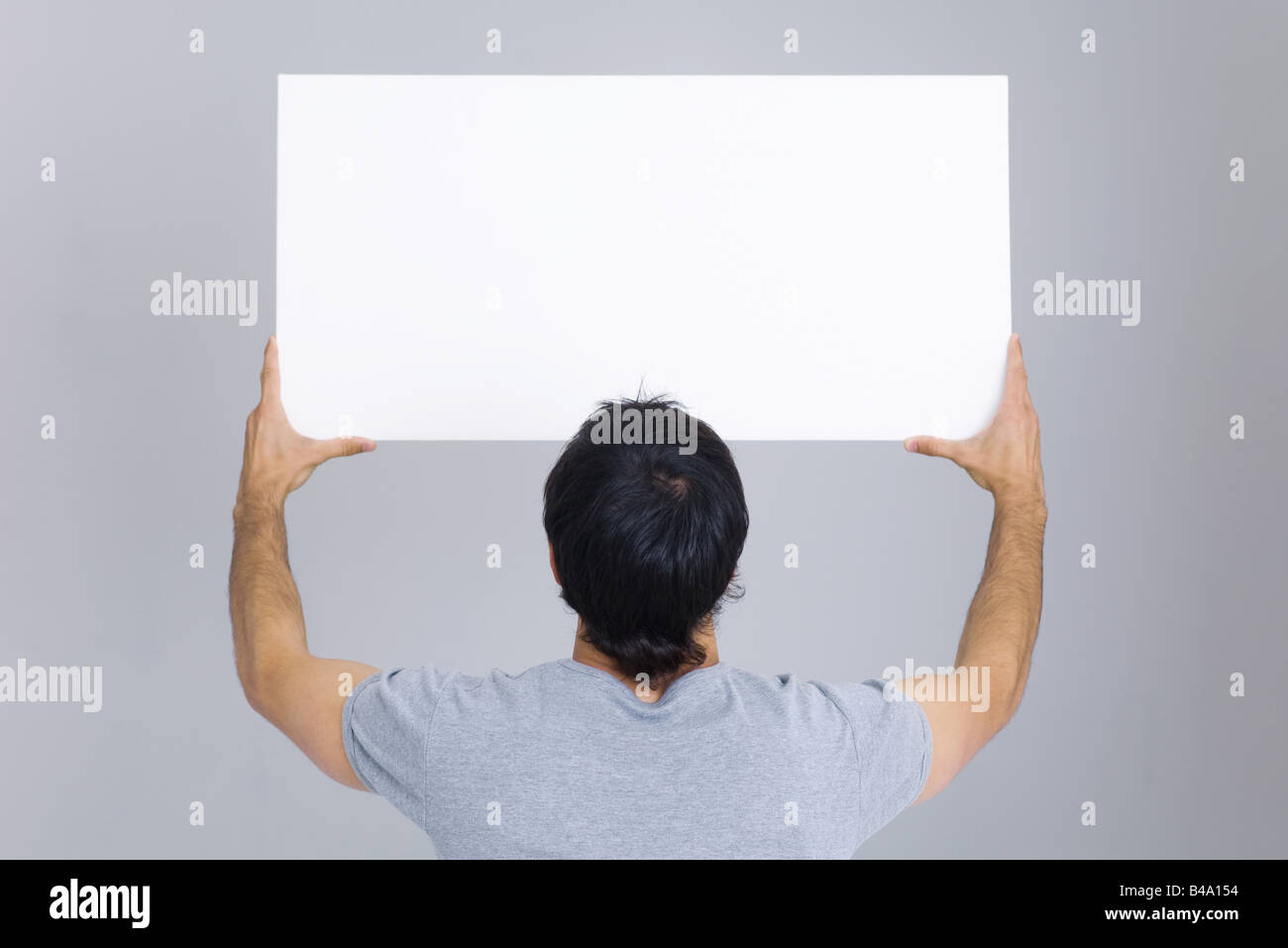 Holding Up Signs High Resolution Stock Photography and Images - Alamy