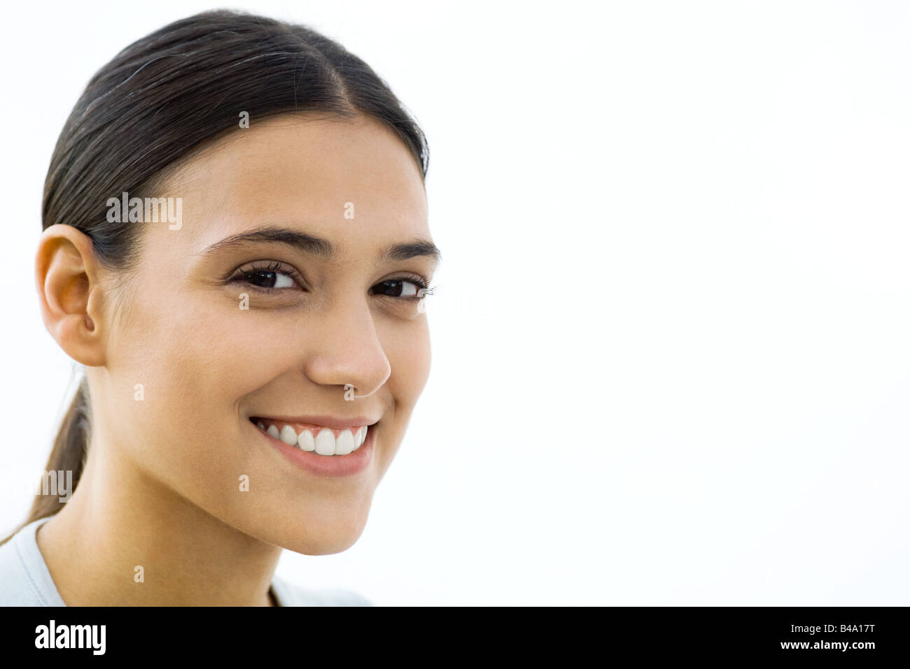 Young woman smiling at camera, portrait Stock Photo - Alamy