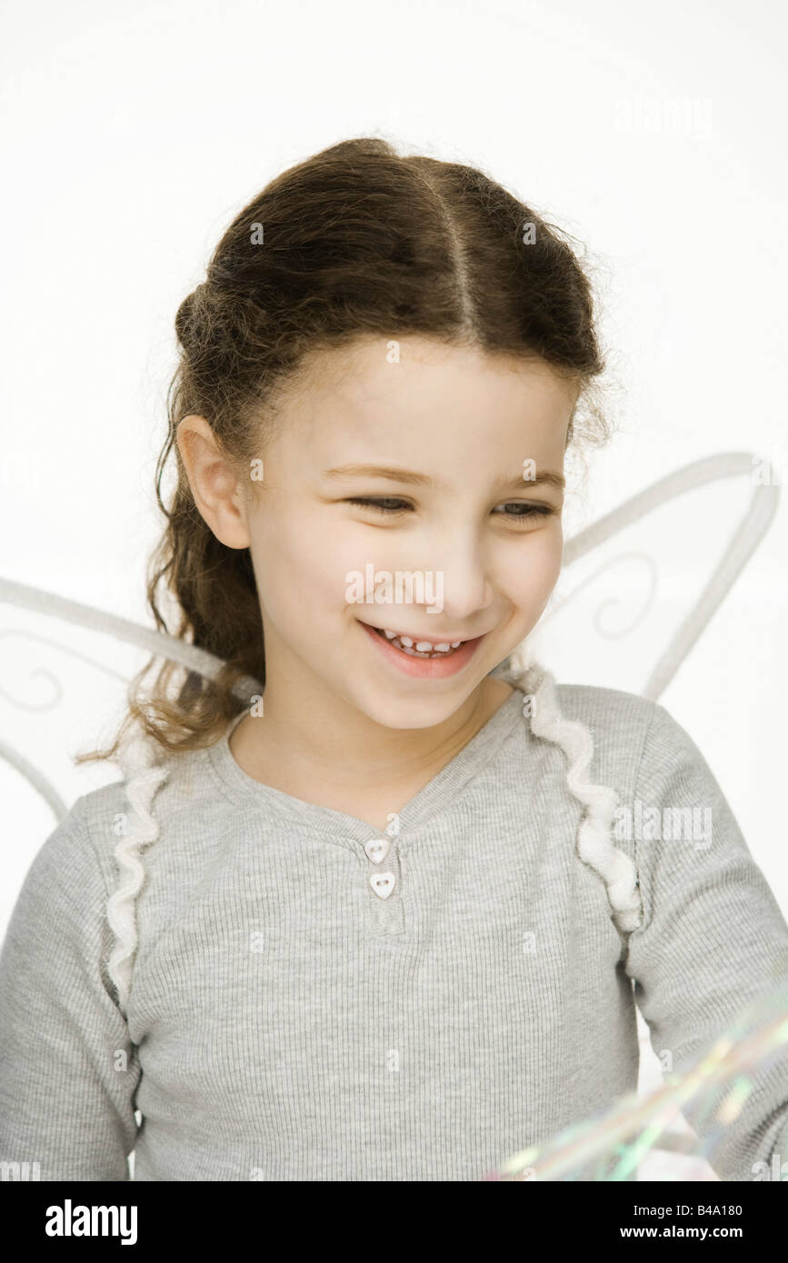 Little girl wearing wings, smiling, portrait Stock Photo - Alamy