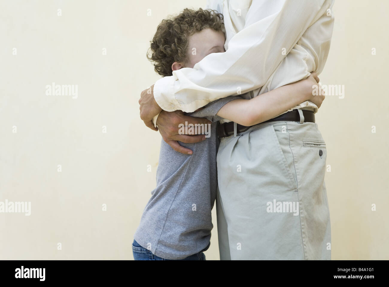Father and son embracing, side view, cropped Stock Photo - Alamy