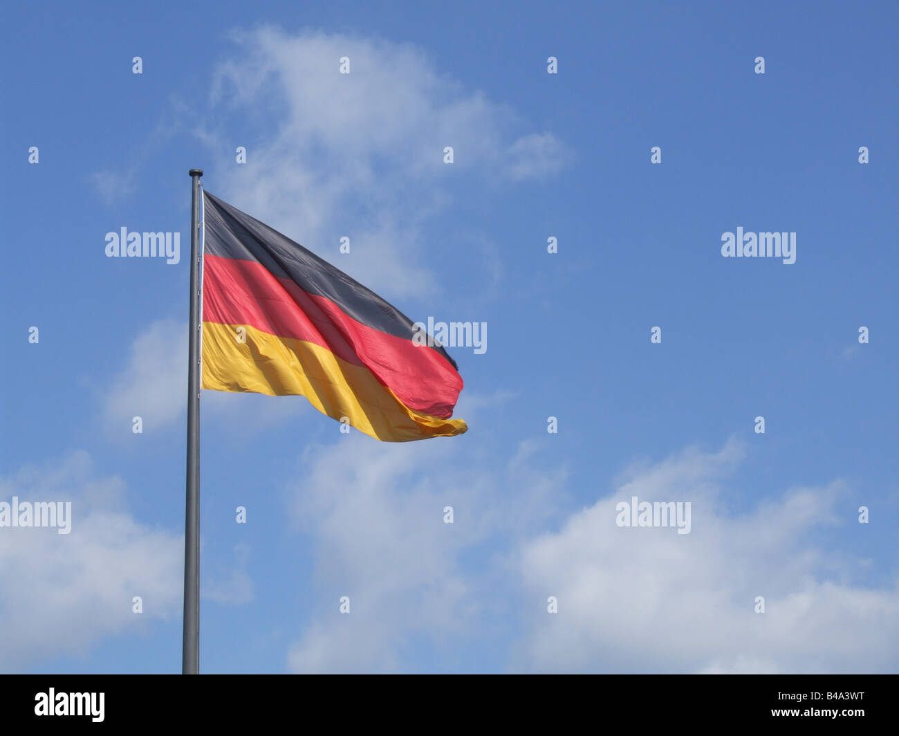 german flag flying in blue sky in berlin Stock Photo - Alamy