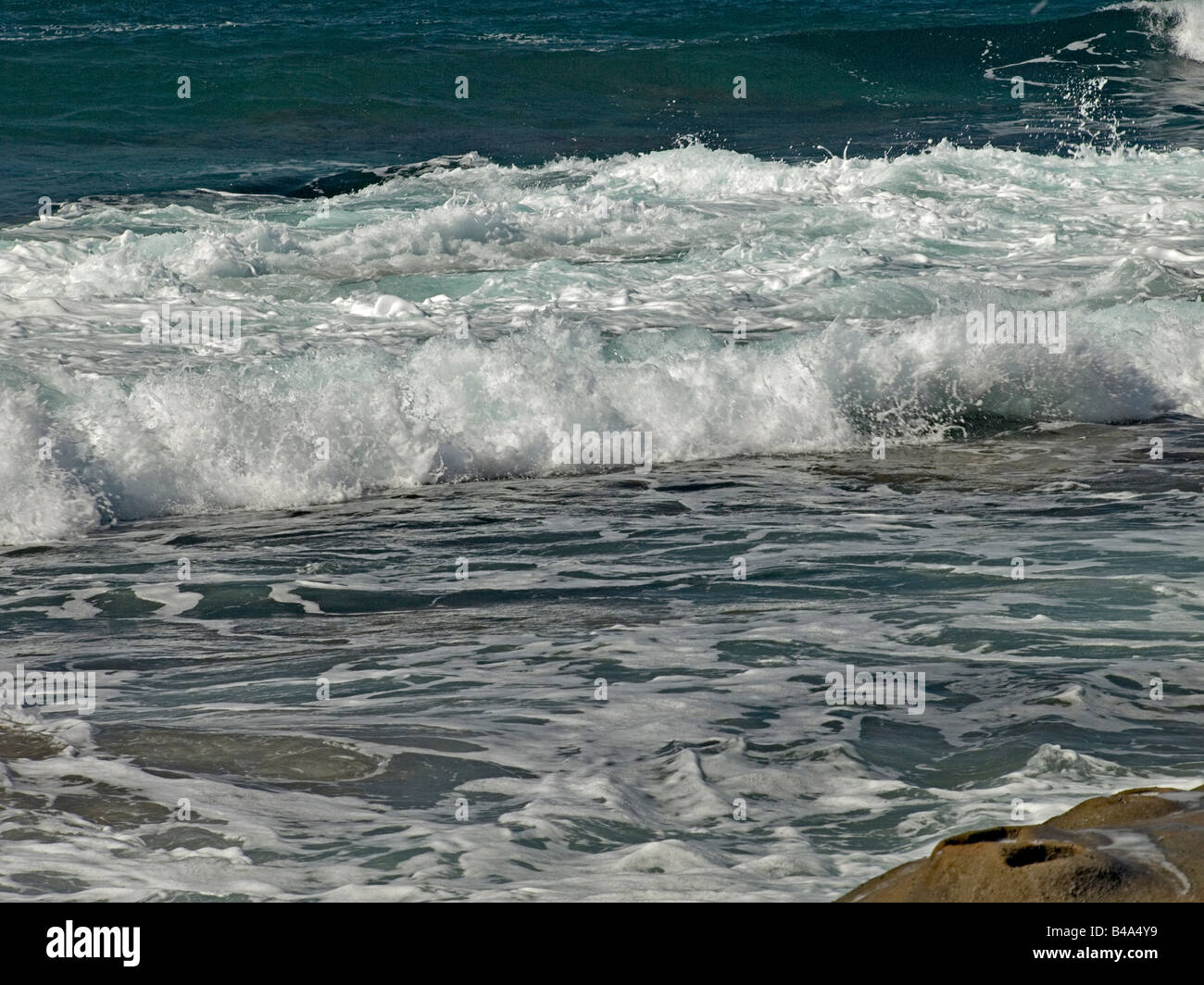 Waves approaching shore Stock Photo - Alamy