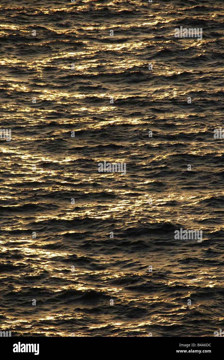 detail of pattern in waves in gold sea at sunset Stock Photo - Alamy