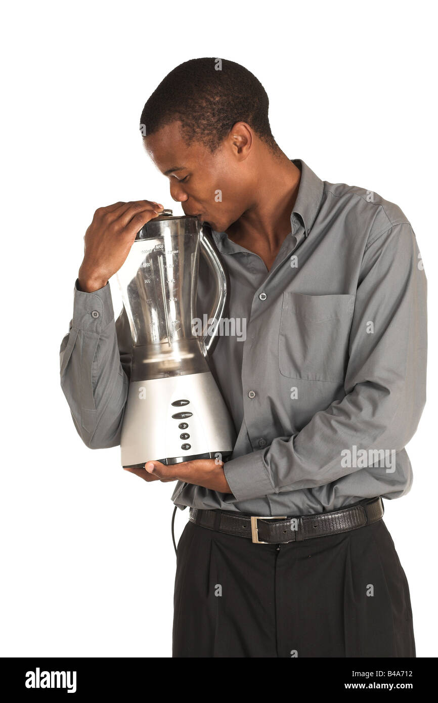 Businessman in grey shirt holding a food blender Kissing it Stock Photo ...