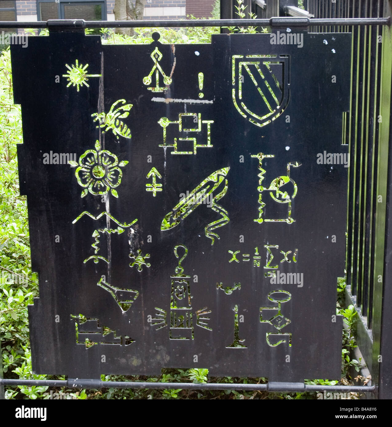 Sculpture showing UMIST crest and scientific symbols outside Weston ...