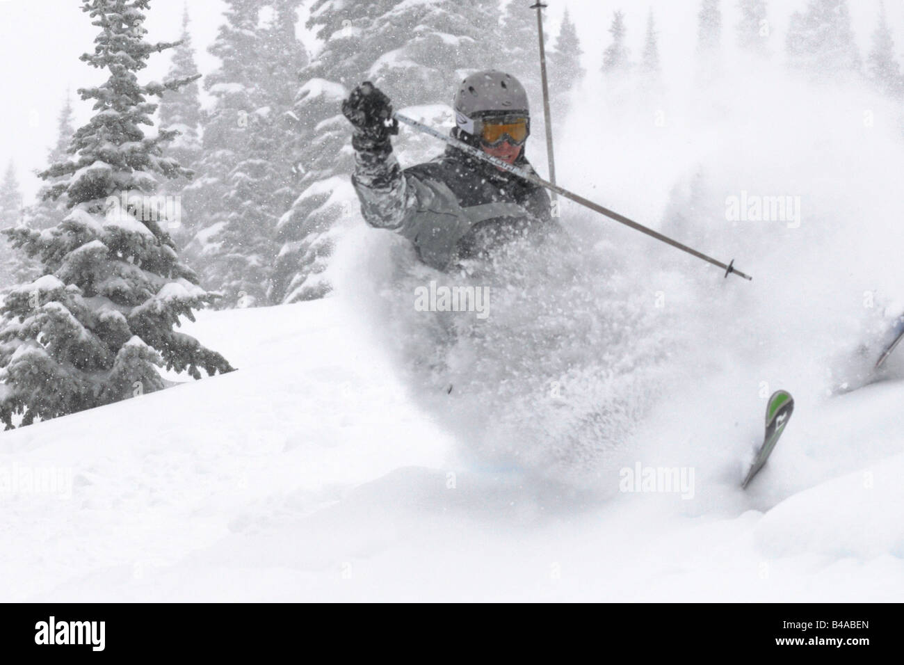 A skier crashin (spectacularly) while skiing deep powder snow druign a ...